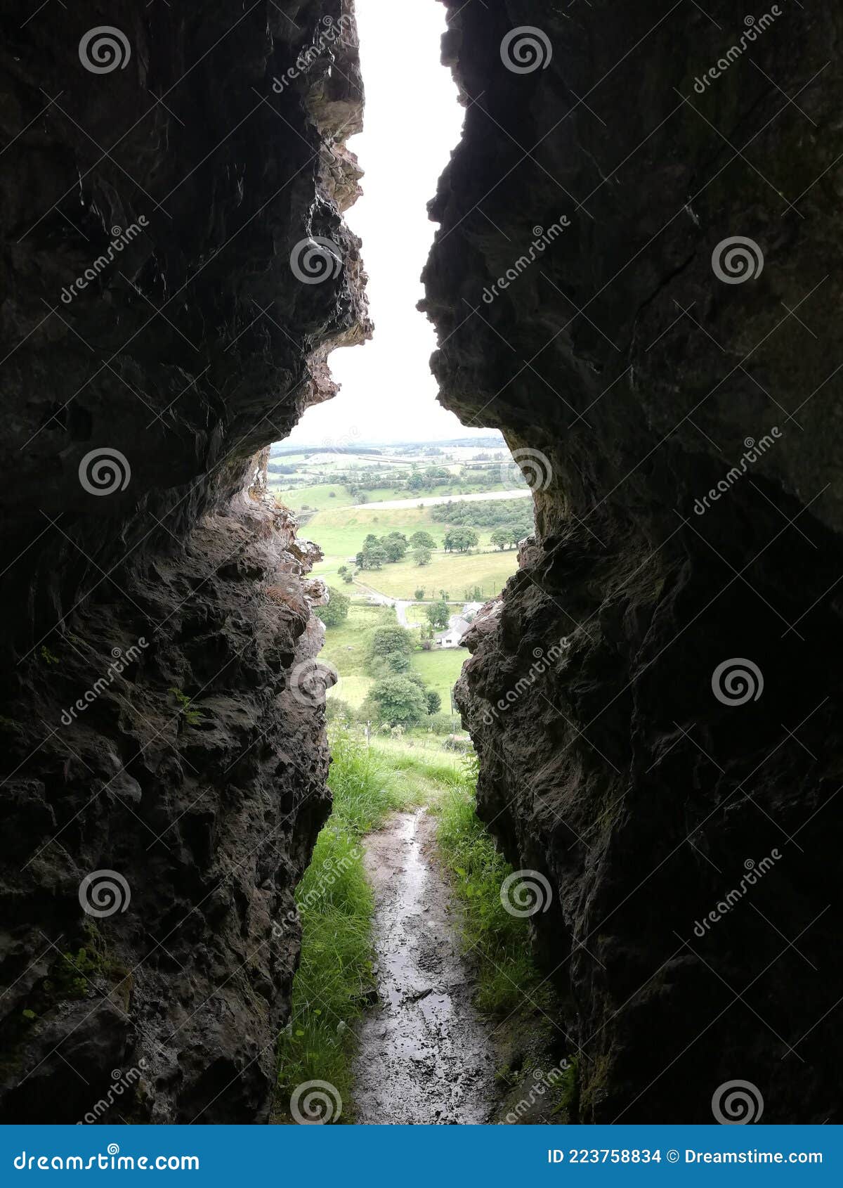 View from Crack through Cave Stock Photo - Image of cave, rock: 223758834
