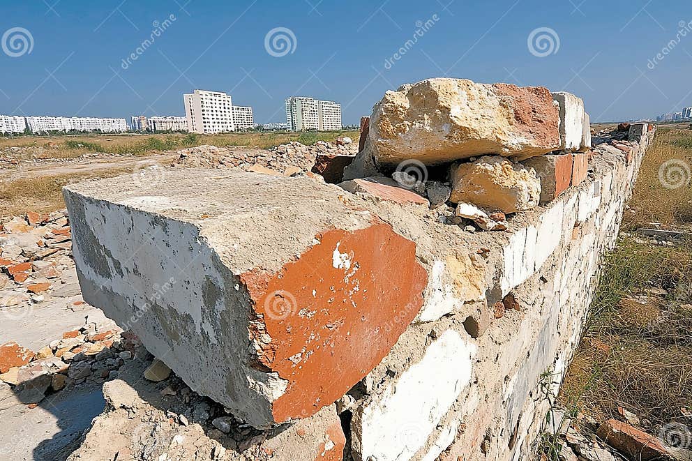 View of a Crumbling Buffer Zone Wall Highlighting Urban Development and ...