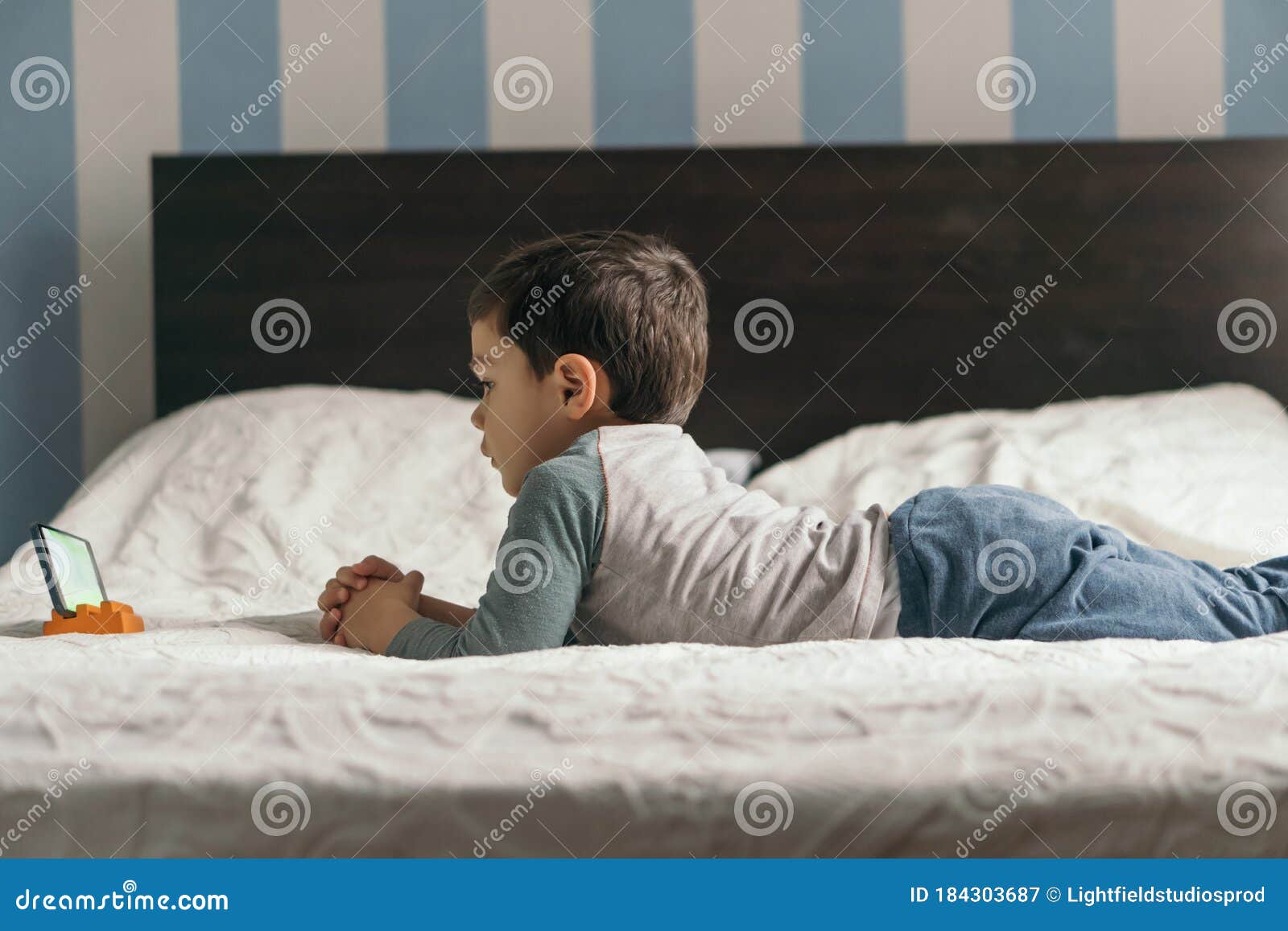Side View of Cute Boy Lying Stock Image - Image of connection ...