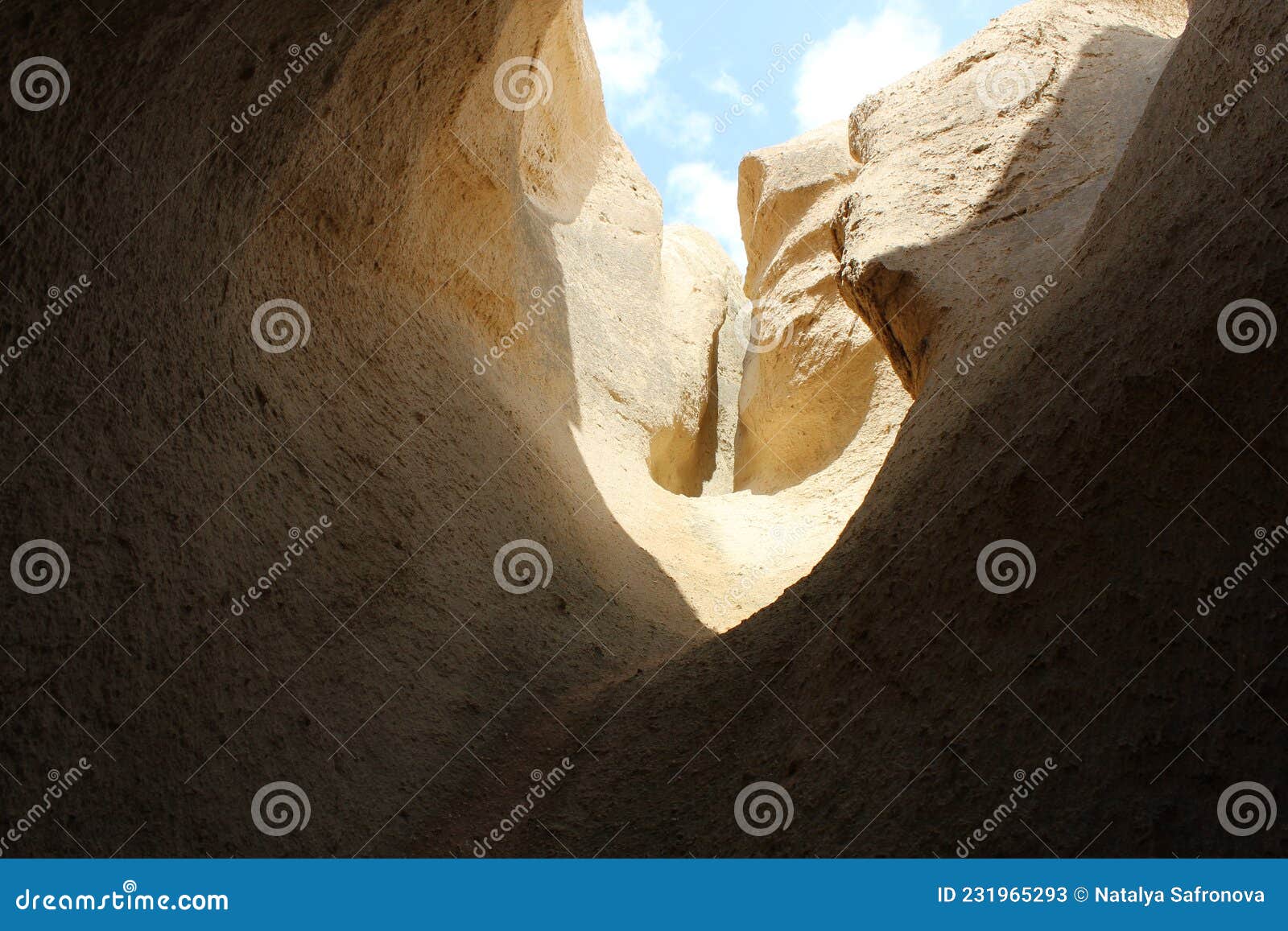 The View from the Dark Sandy Cave Up To the Exit To the Blue Sky Stock ...