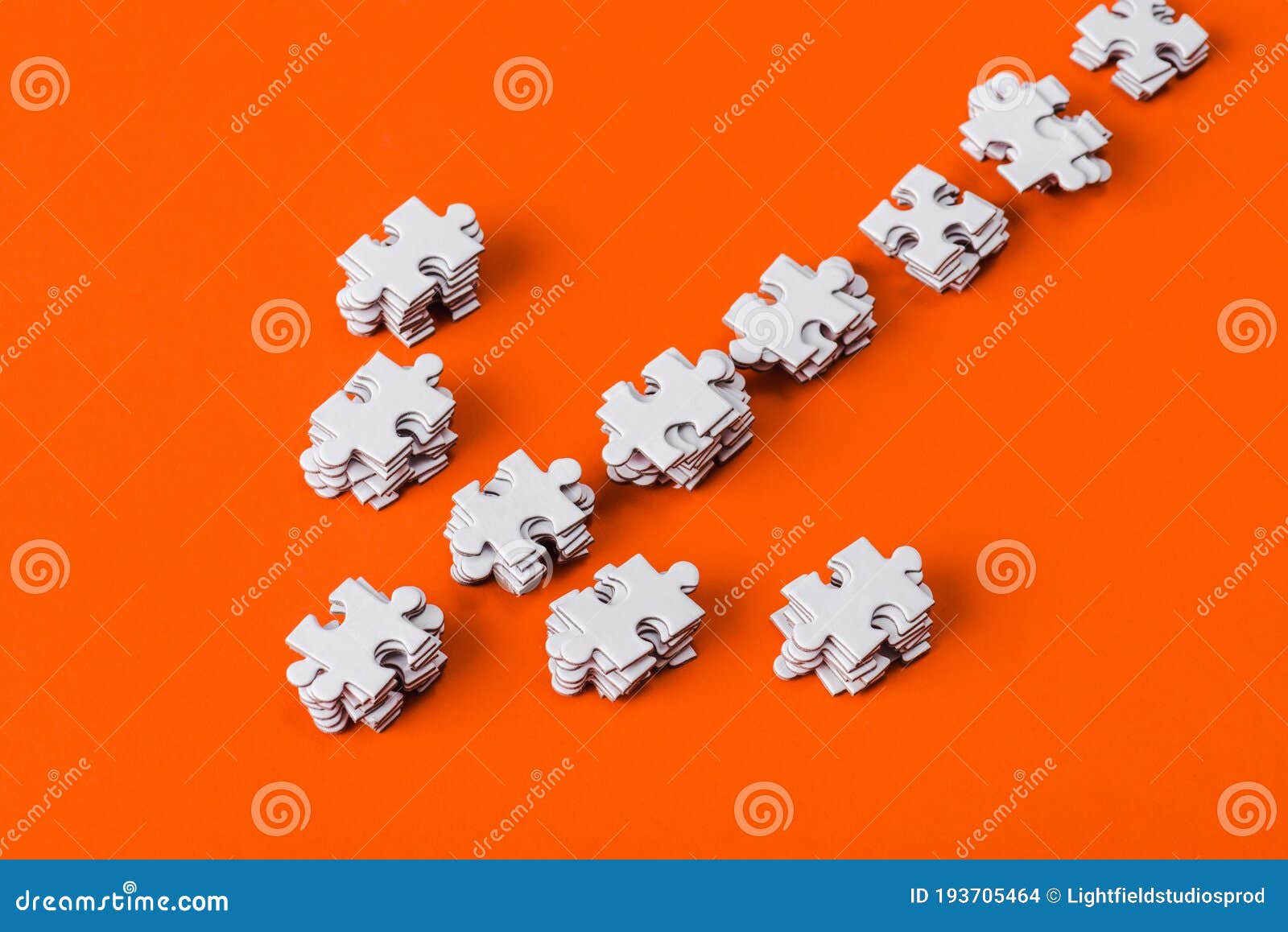 View of Direction Arrow with White Jigsaw Puzzle Pieces on Orange Stock ...