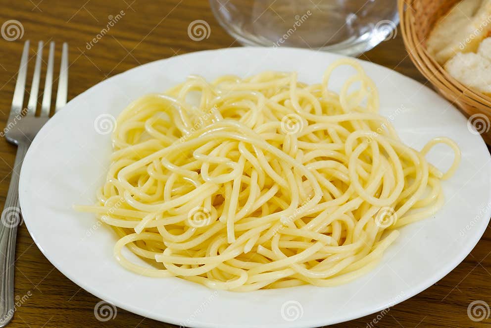 Dish of Plain Cooked Spaghetti on a Table Stock Image - Image of pasta ...