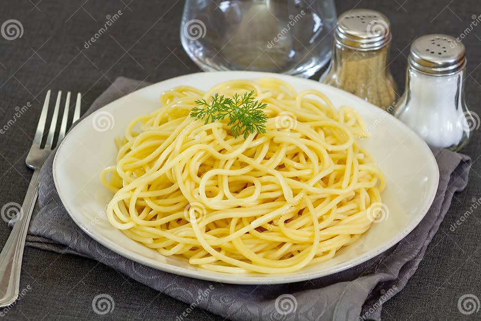 Dish of Plain Cooked Spaghetti on a Table Stock Image - Image of glass ...