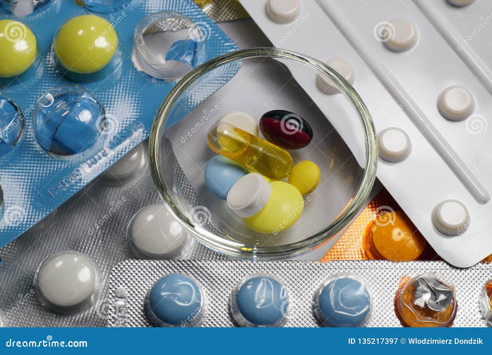 A daily Dose of Medication on the Background of Packaging with Pills ...