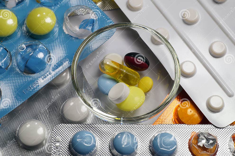 A daily Dose of Medication on the Background of Packaging with Pills ...