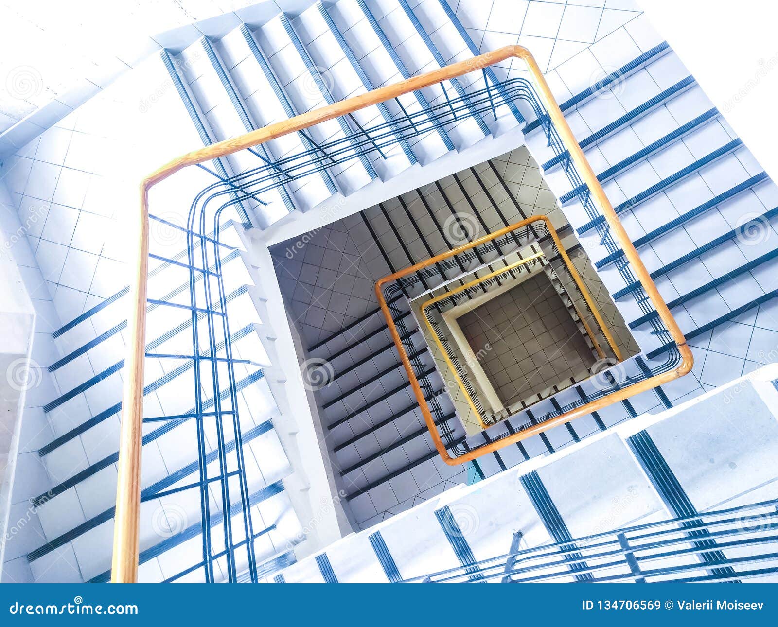 View Down a Light Spiraling Square Staircase Stock Image - Image of ...