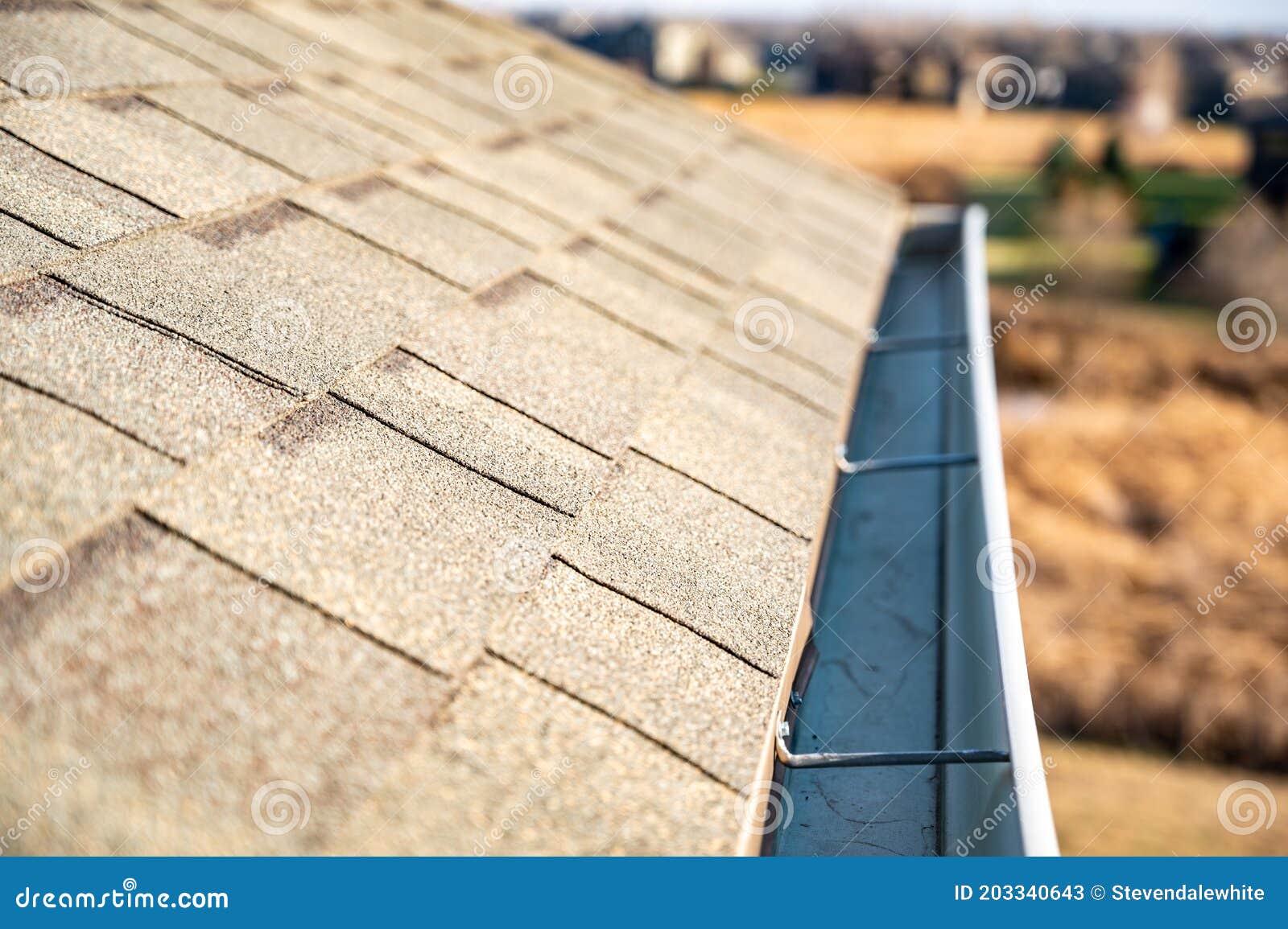 View Down a Roof Gutter with Clips and Edge of Shingles Stock Image ...
