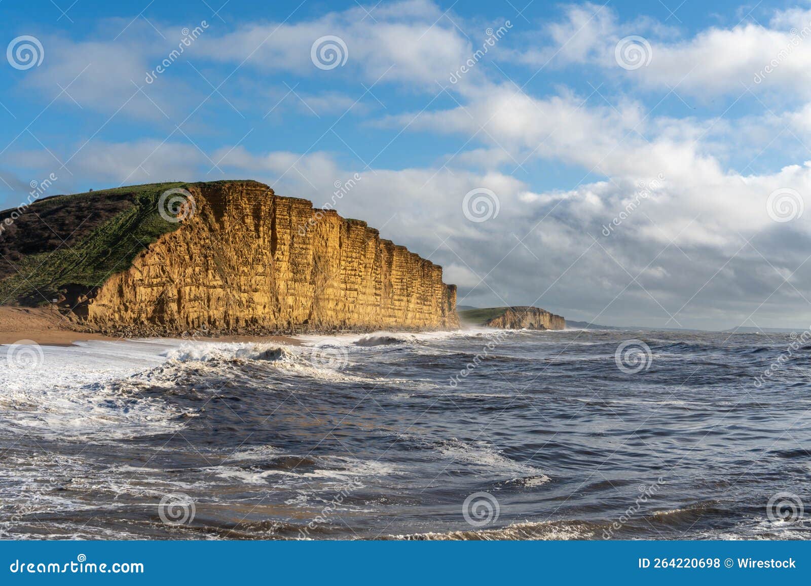 A View of the Dramatic Sunlit Cliffs at West Bay, Dorset, UK. Stock ...