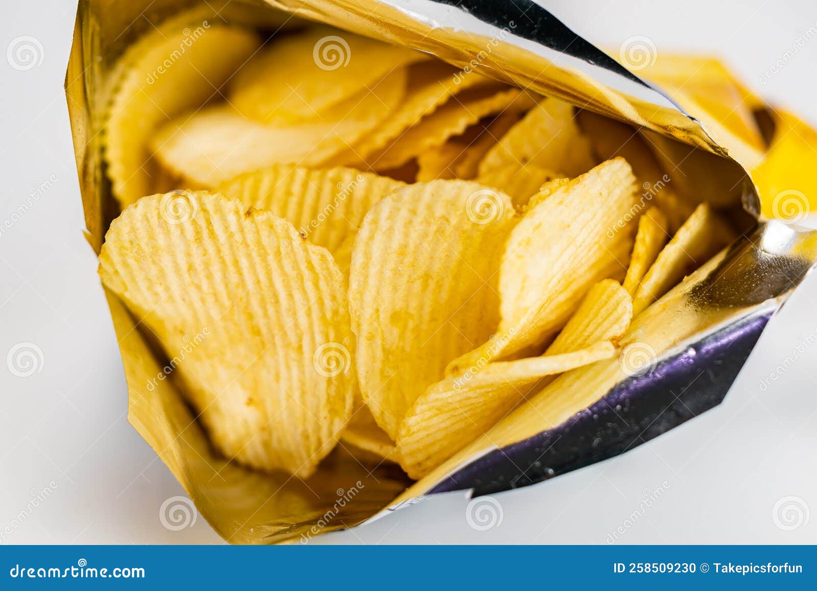 View of Dry Crispy Fried Corrugated Potato Chips in Open Bag Stock ...