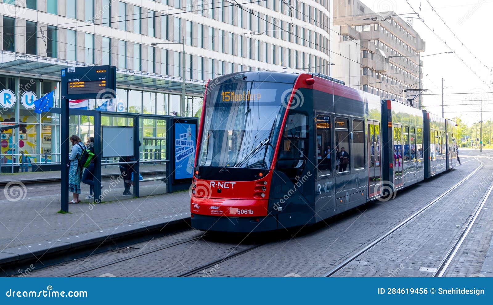 View of Dutch Grey with Red R-Net Tram in Front of the Dan Hague ...