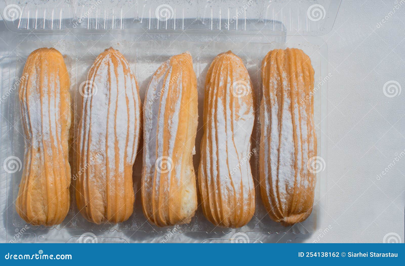 View of eclairs with sugar stock photo. Image of letter - 254138162