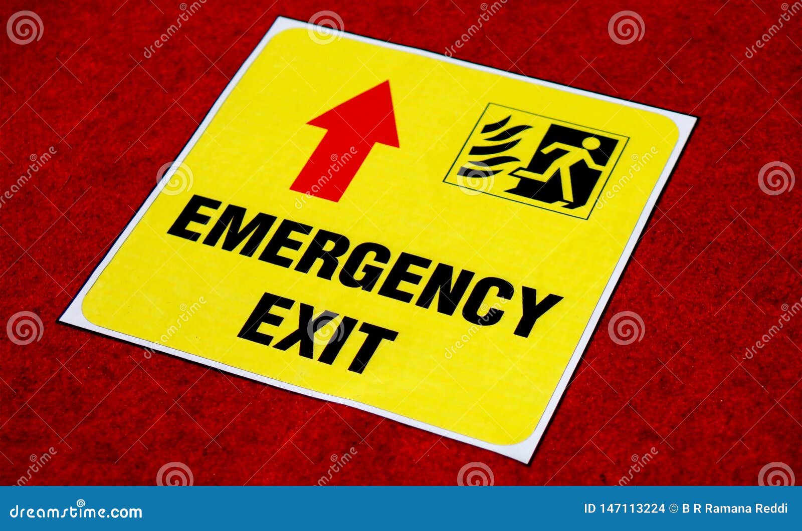View of Emergency Exit Way Sign Sticker on the Floor in a Public Place ...