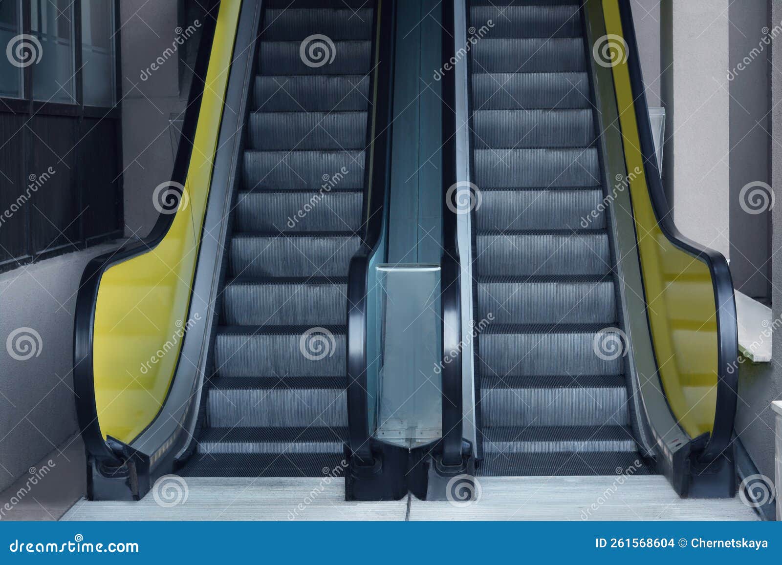 View on Empty Parallel Escalators with Yellow Balustrades Stock Photo ...