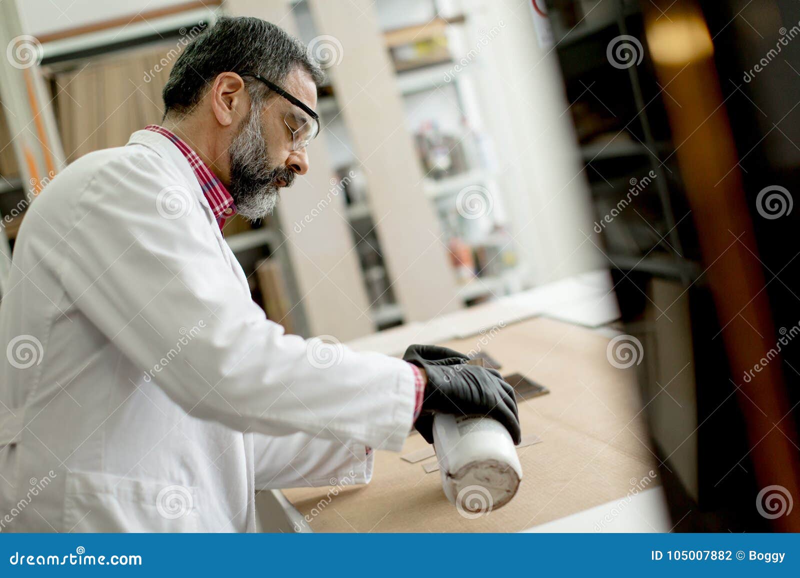 Engineer in the Laboratory Examines Ceramic Tiles Stock Photo - Image ...