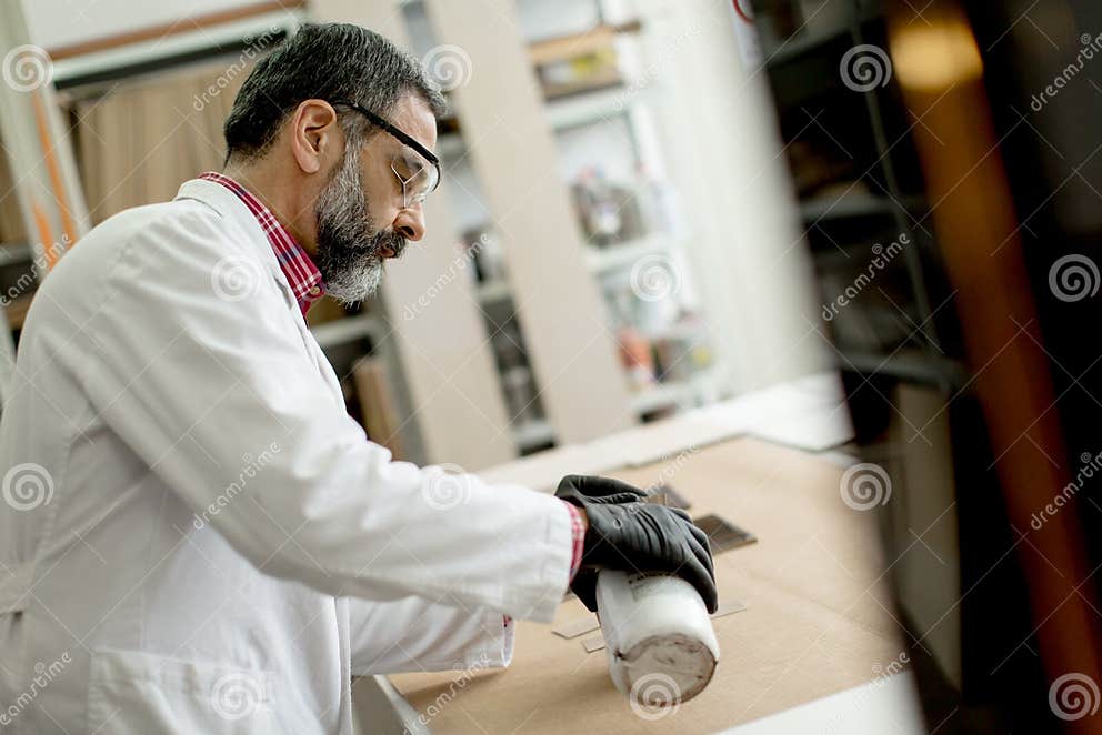 Engineer in the Laboratory Examines Ceramic Tiles Stock Photo - Image ...