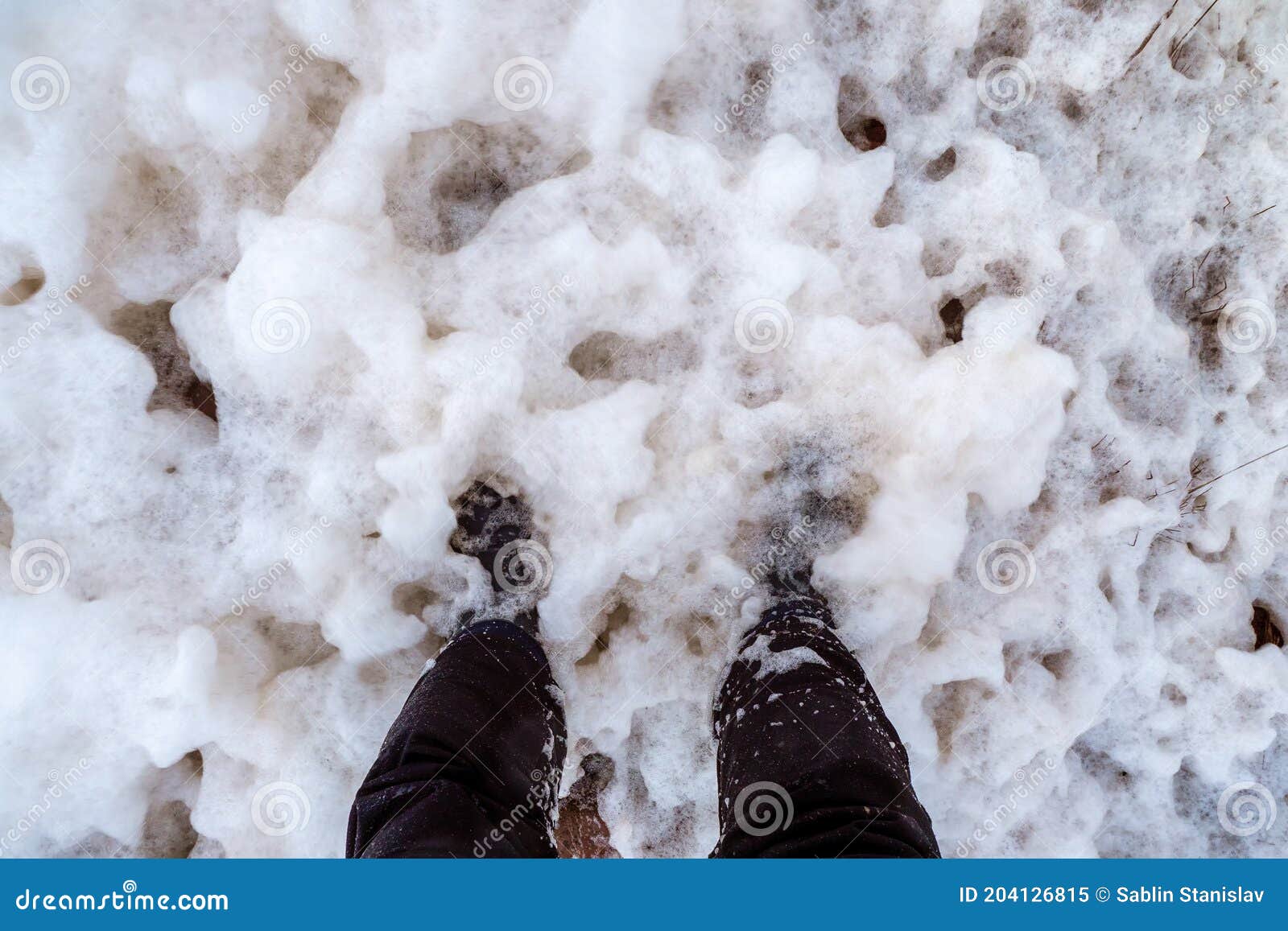View of the Feet Drowning in the Cold Thick Sea Foam. White Sea Stock ...