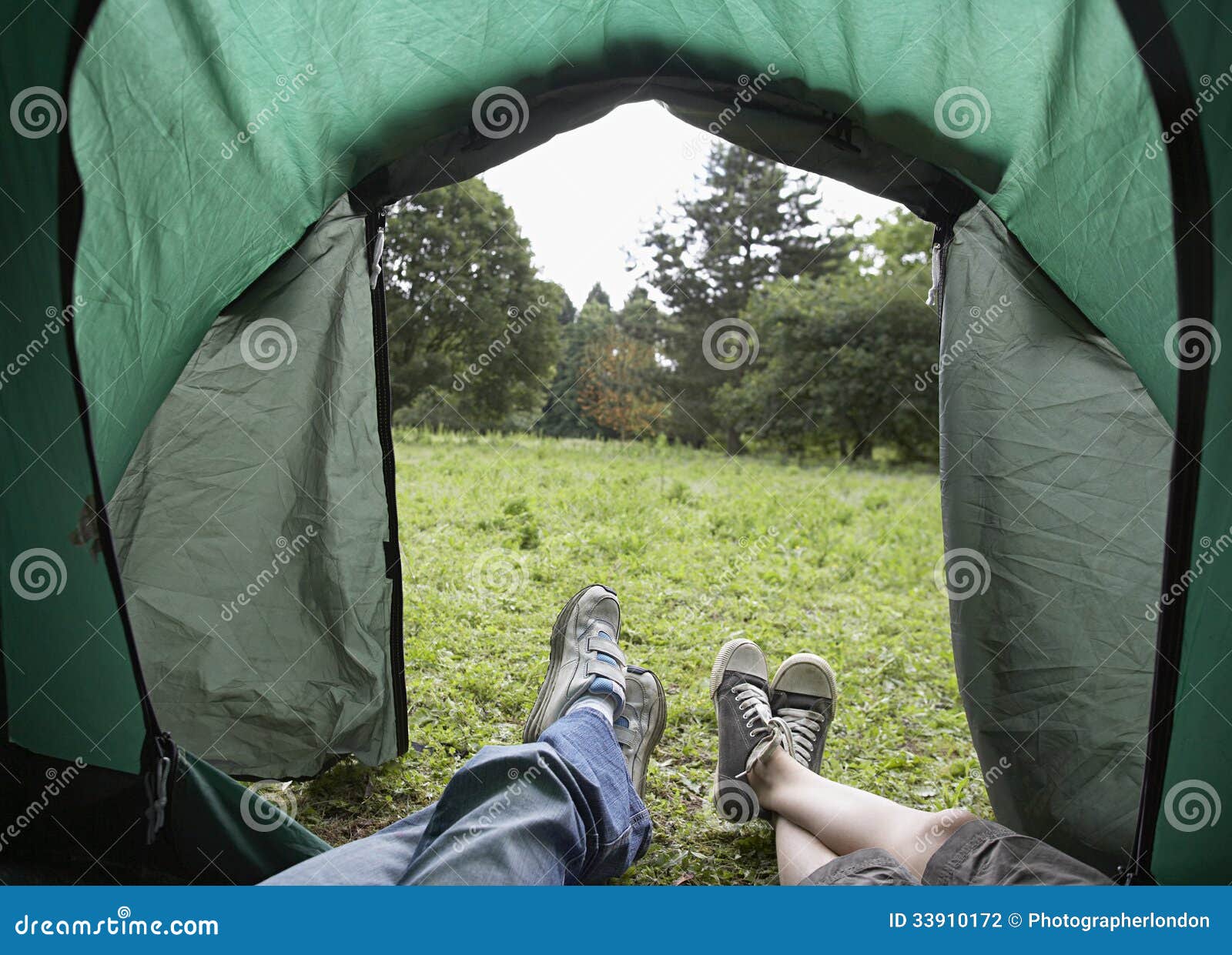 View of Feet in Tent stock photo. Image of people, grass - 33910172