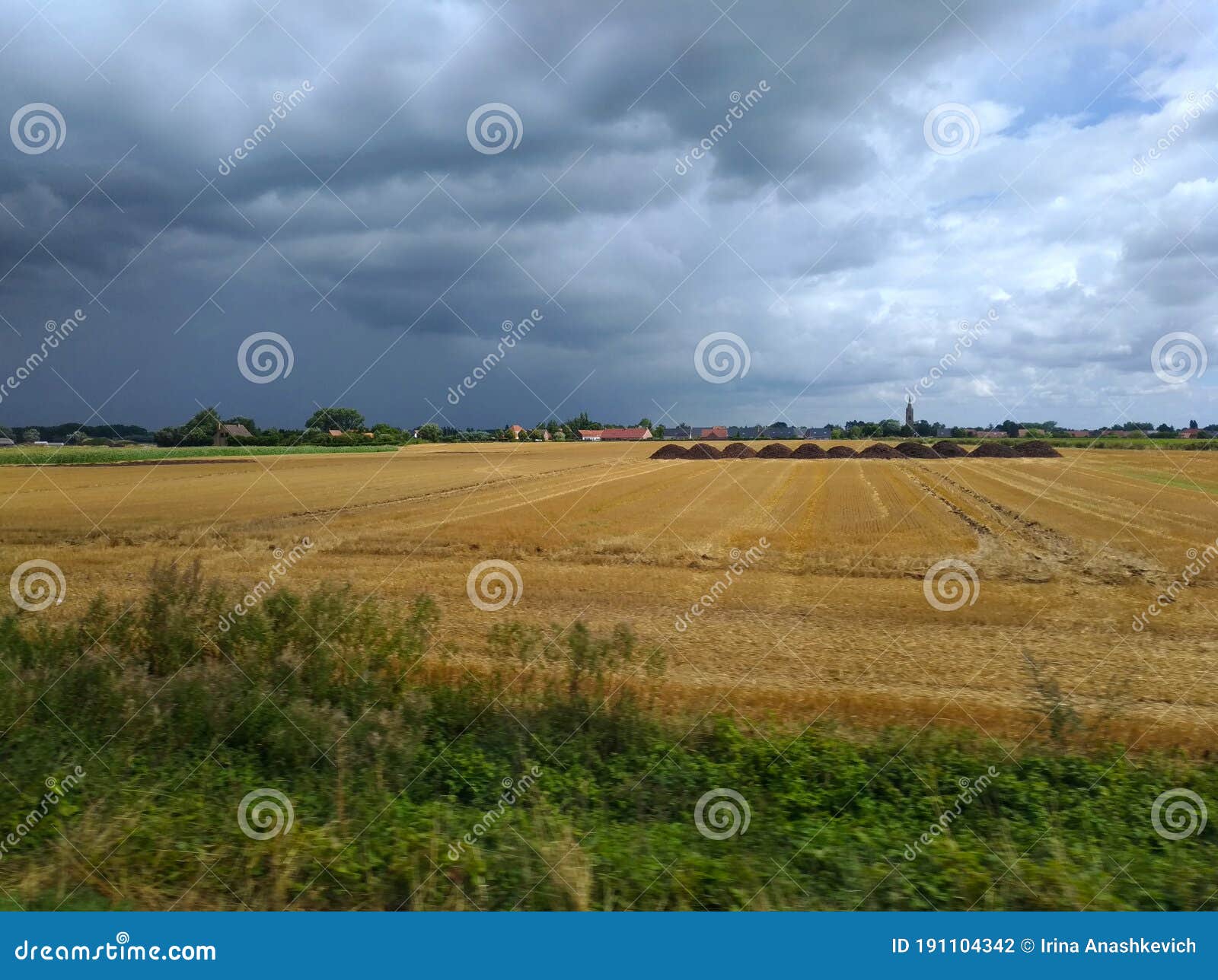 View of the Field after Harvesting. Dark Sky before the Rain Over the ...