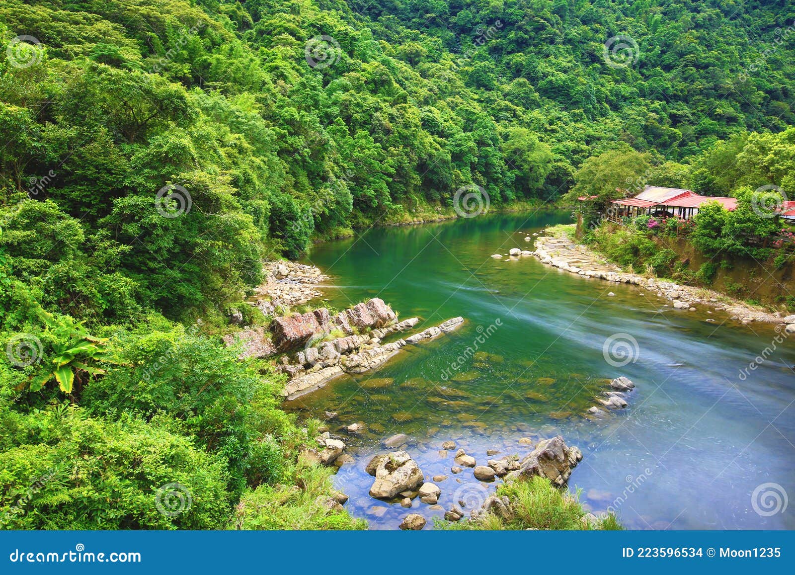 The View of Flowing River with Rocks and Hut Stock Photo - Image of ...