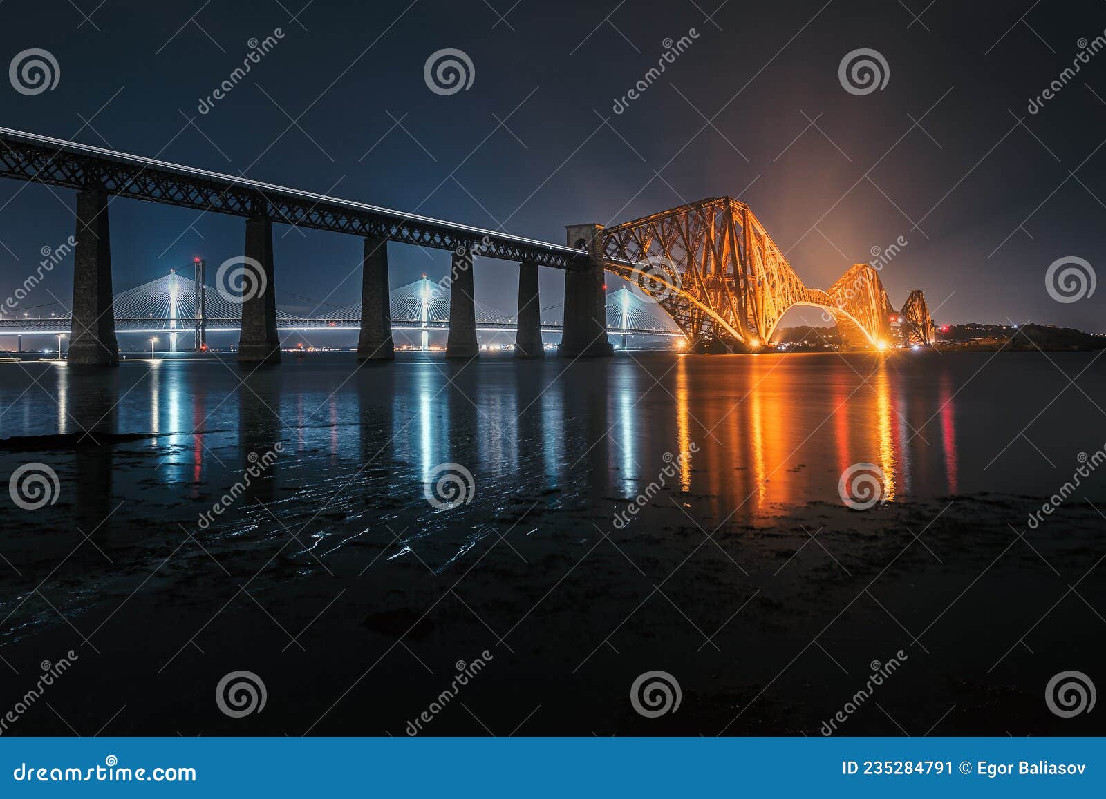 View of Forth Rail Bridge at Night and and the Glow Trail of a Moving ...