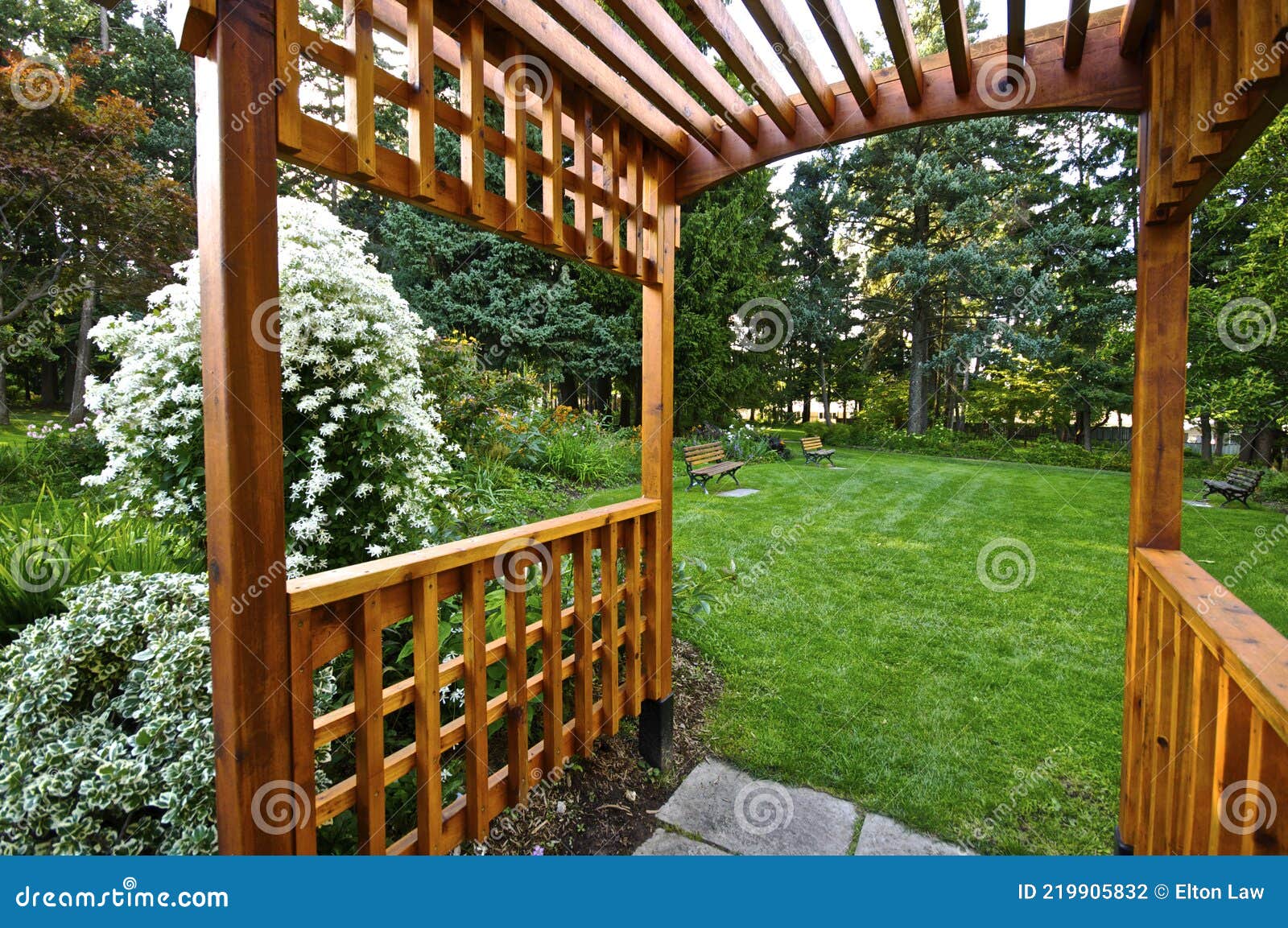 The View of the Front Yard with Wooden Benches and Canopy in a Public ...