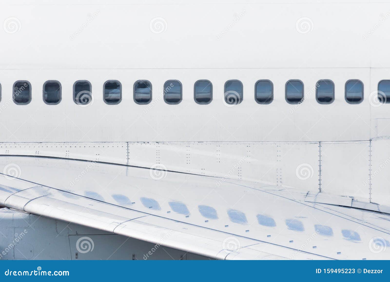 View of the Fuselage of the Aircraft and Many Windows, with Reflection ...