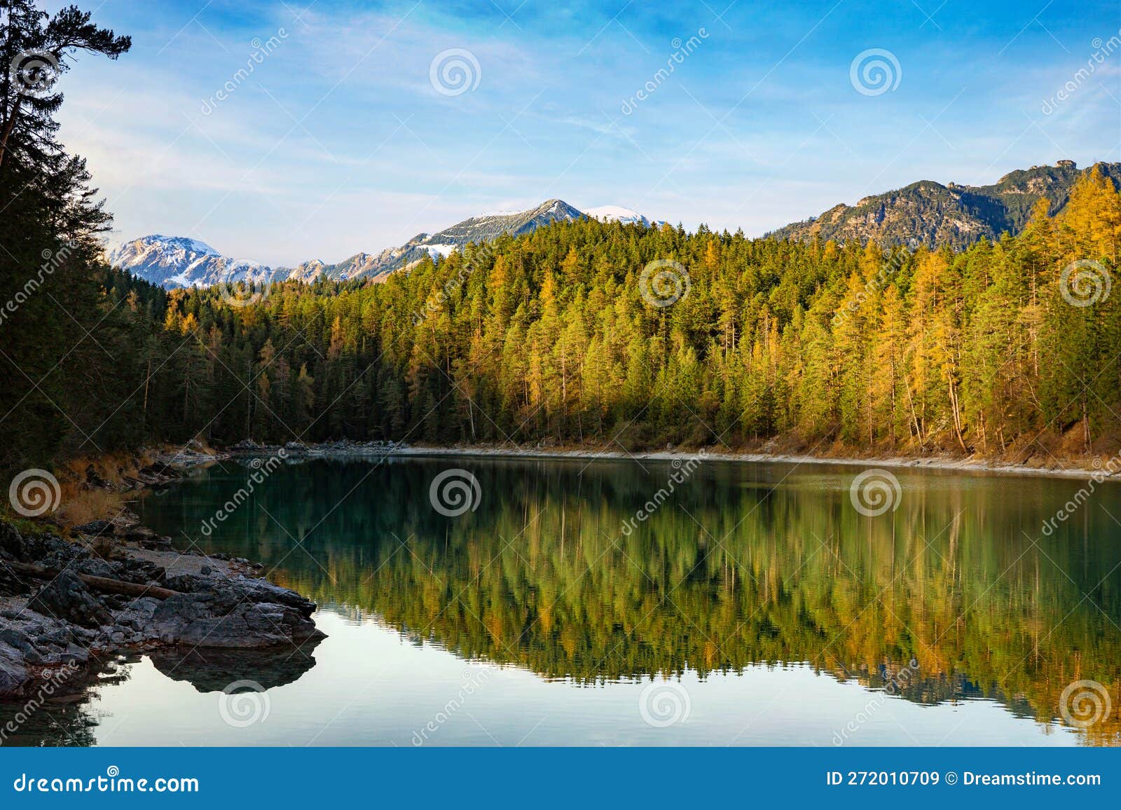 A View Of German Alp Mountains On A Lake Eibsee And A Lake With A Peaks ...