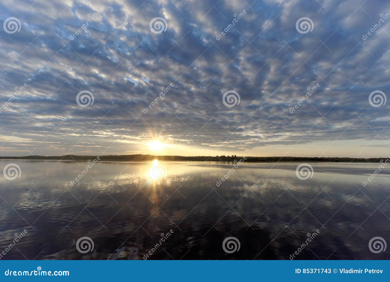 View of the Golden Sunset on the River with Clouds and the Sun ...