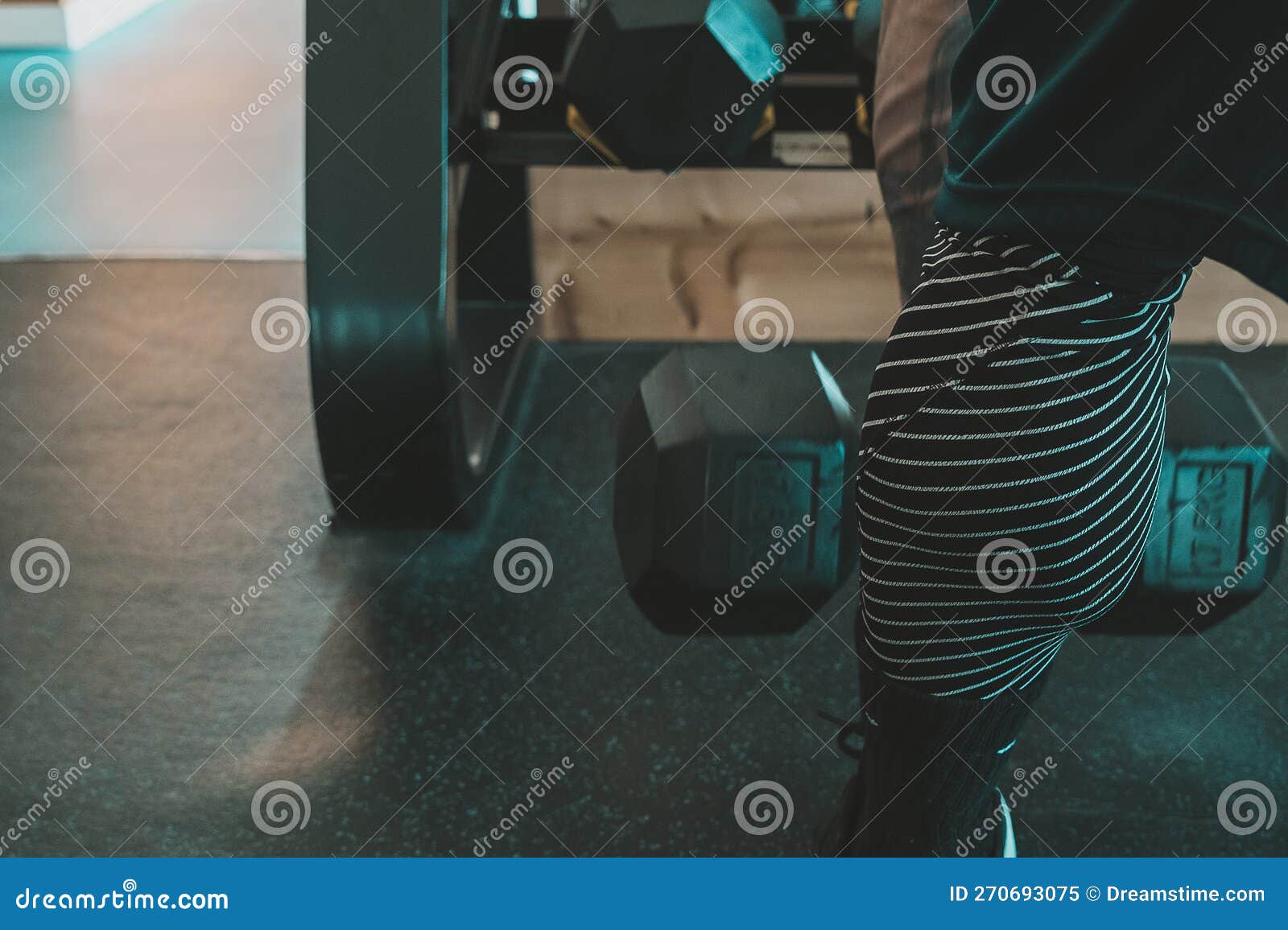 View from the Ground of a Person Lifting a Dumbbell in the Gym Stock ...