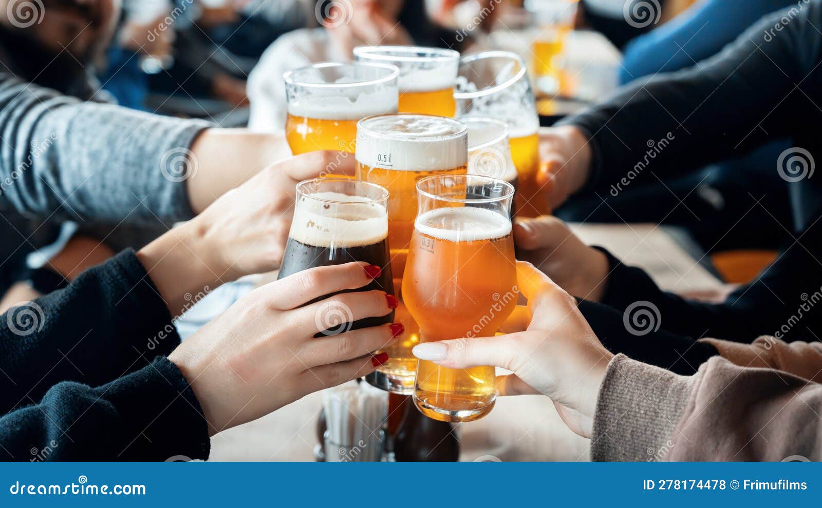 A Group of People Clinking Glasses with Beer Stock Photo - Image of ...