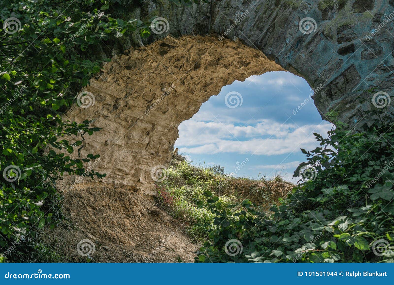 View through the Half-buried Passage through a Castle Wall Against the ...
