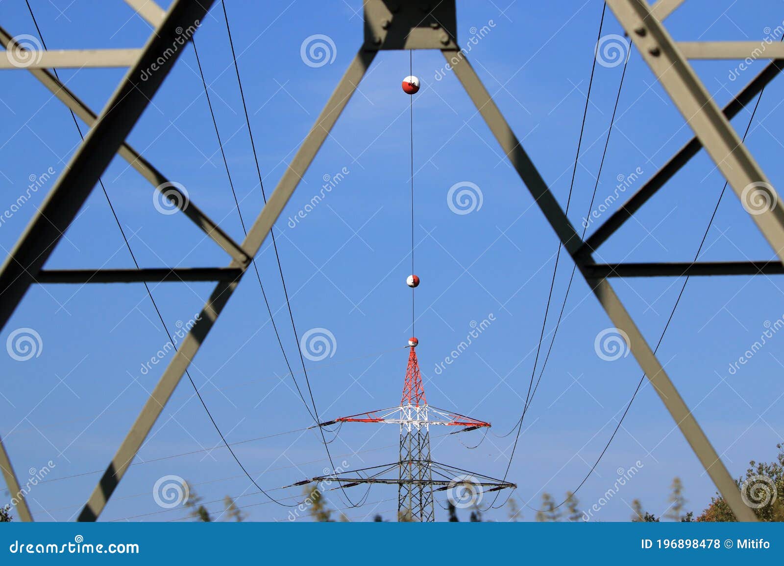 View through a High-voltage Pylon at Flight Warning Balls for Securing ...