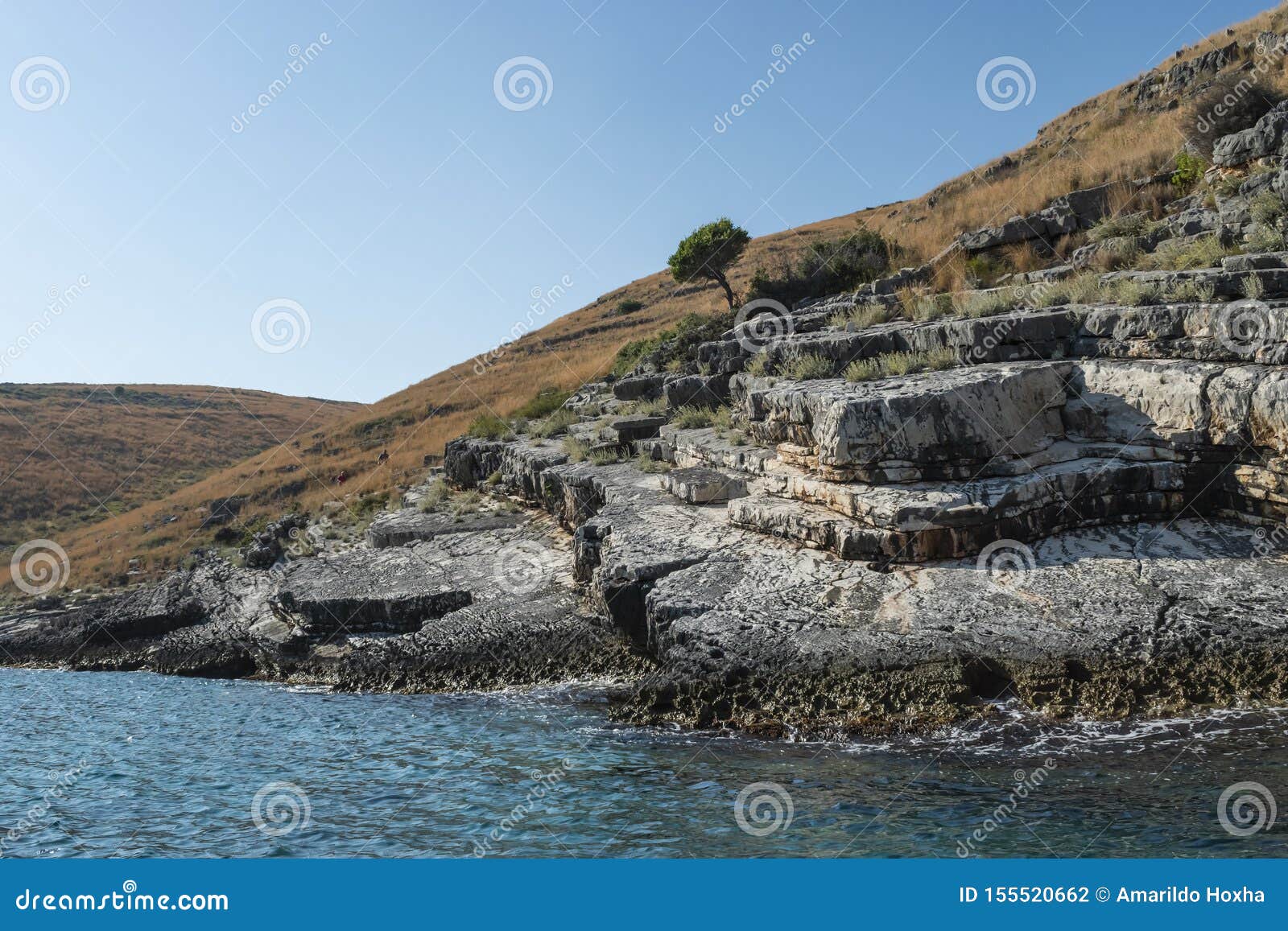 View of Himara rocky shore stock photo. Image of riviera - 155520662