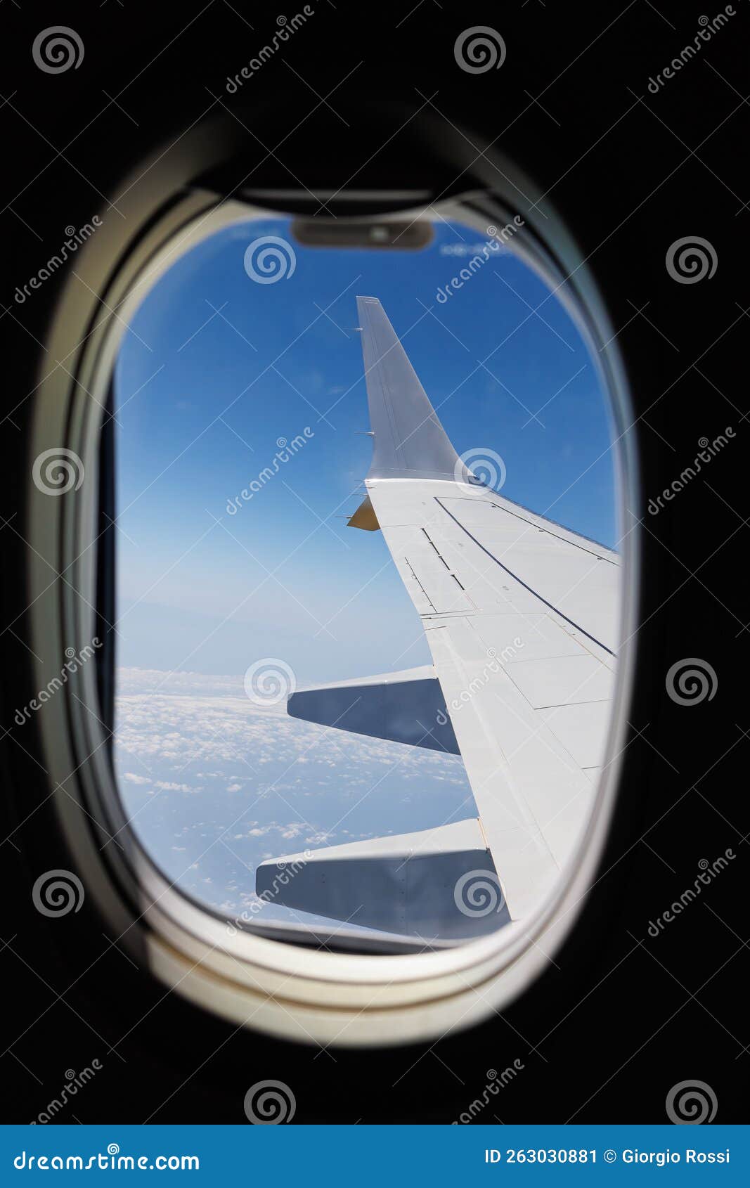 View from Inside an Aircraft: Window of the Cabin, White Airplane Wing ...