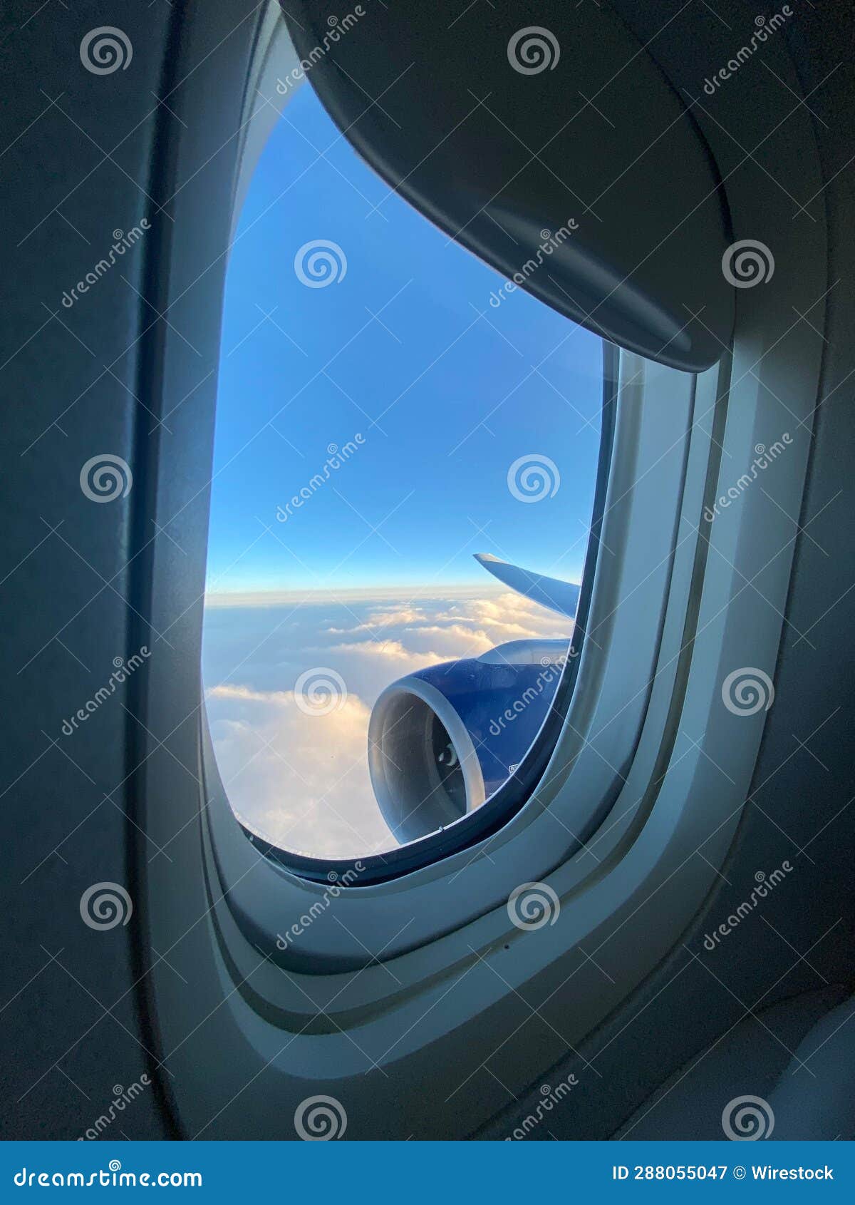 The View from Inside an Airplane Shows the Wing of the Plane Stock ...