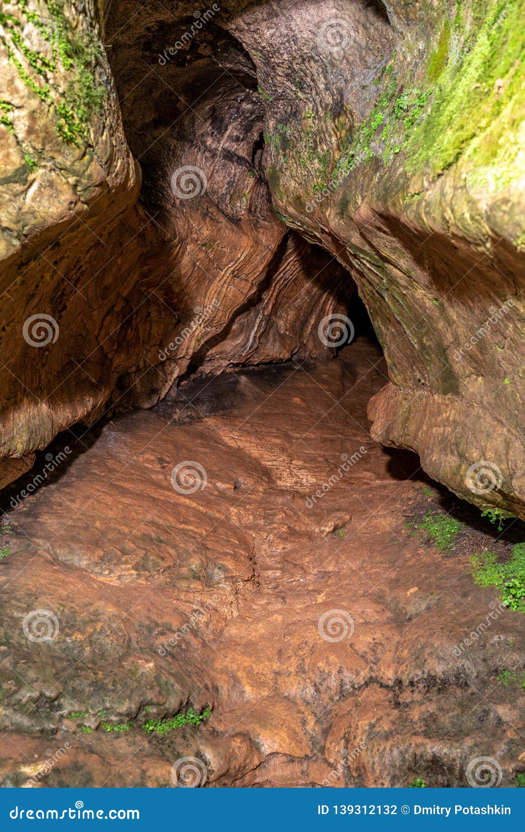 View Inside the Ancient Cave with Stone Walls with Additional Lighting ...