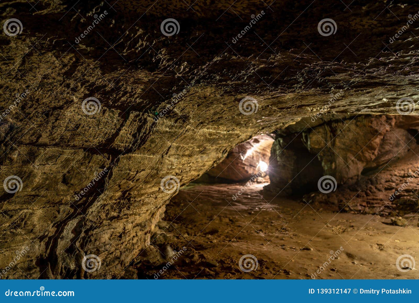 View Inside the Ancient Cave with Stone Walls with Additional Lighting ...