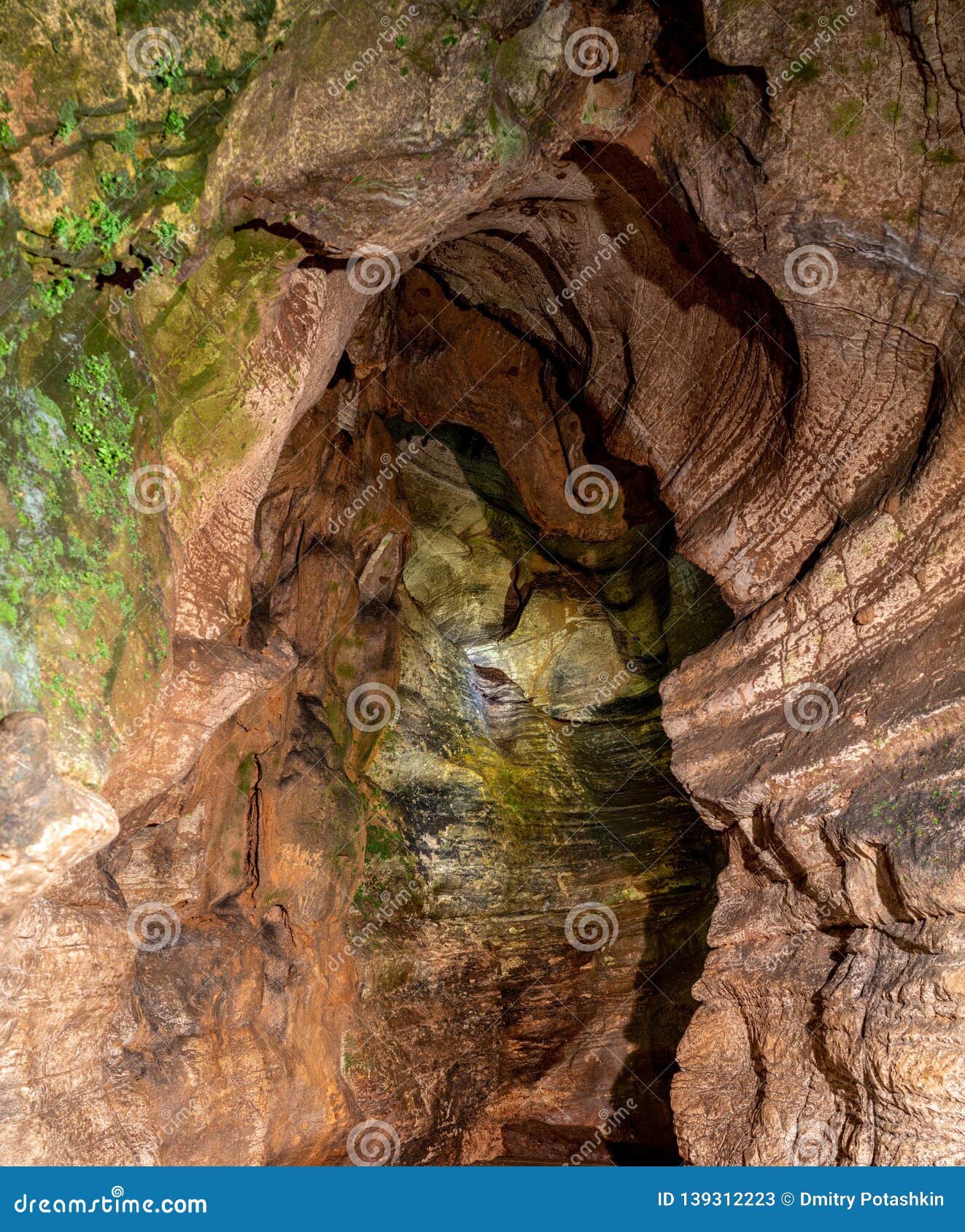 View Inside the Ancient Cave with Stone Walls with Additional Lighting ...