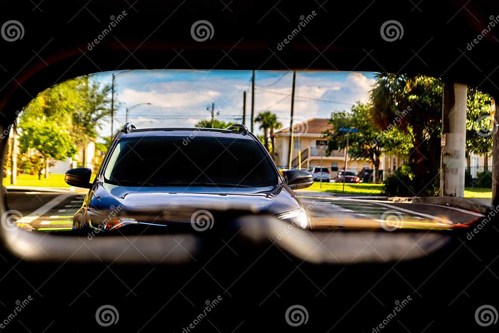 The View from Inside the Back Rear Window of a Car in a Line in Front ...