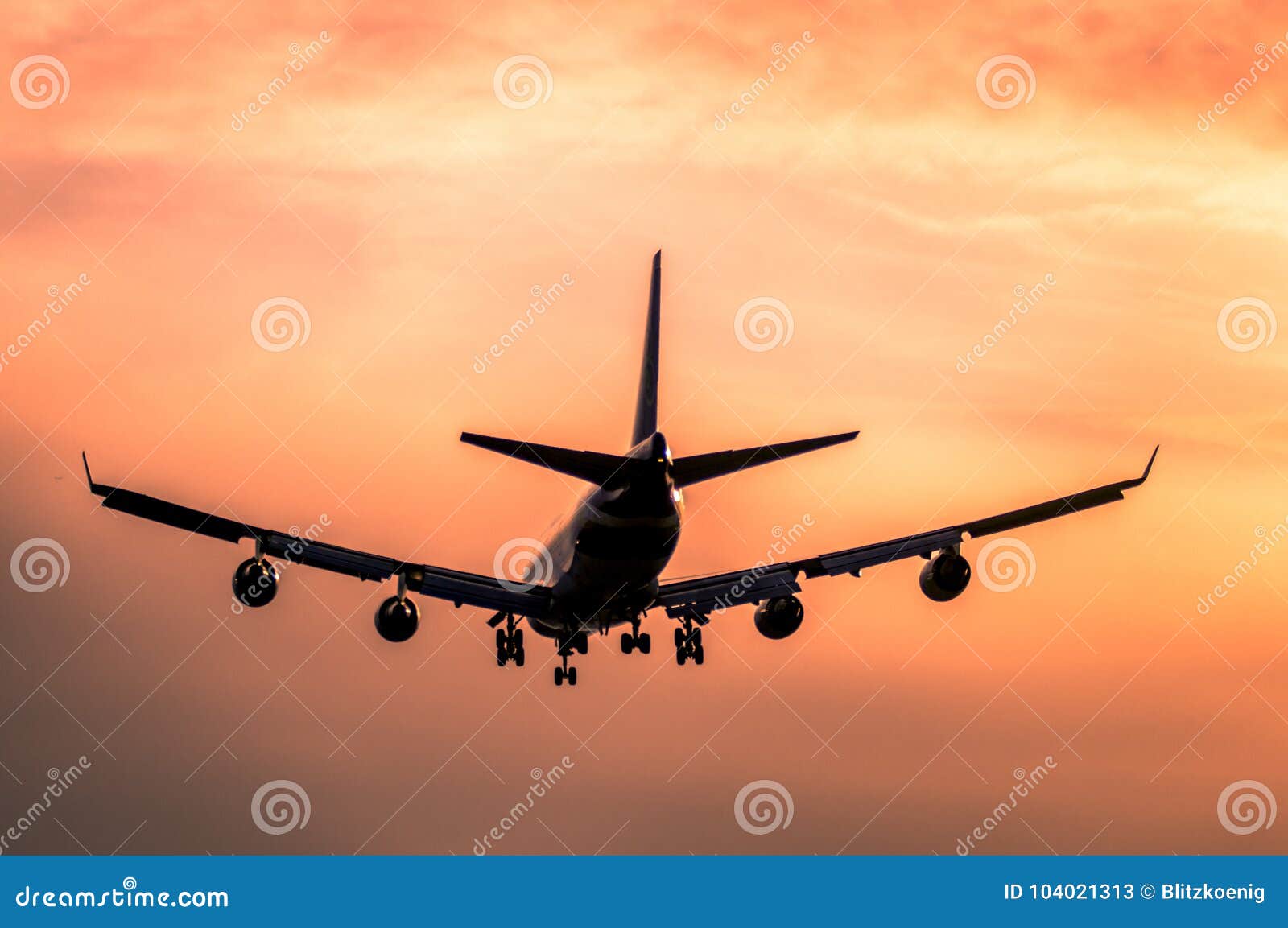 Airplane landing at sunset stock image. Image of airplane - 104021313