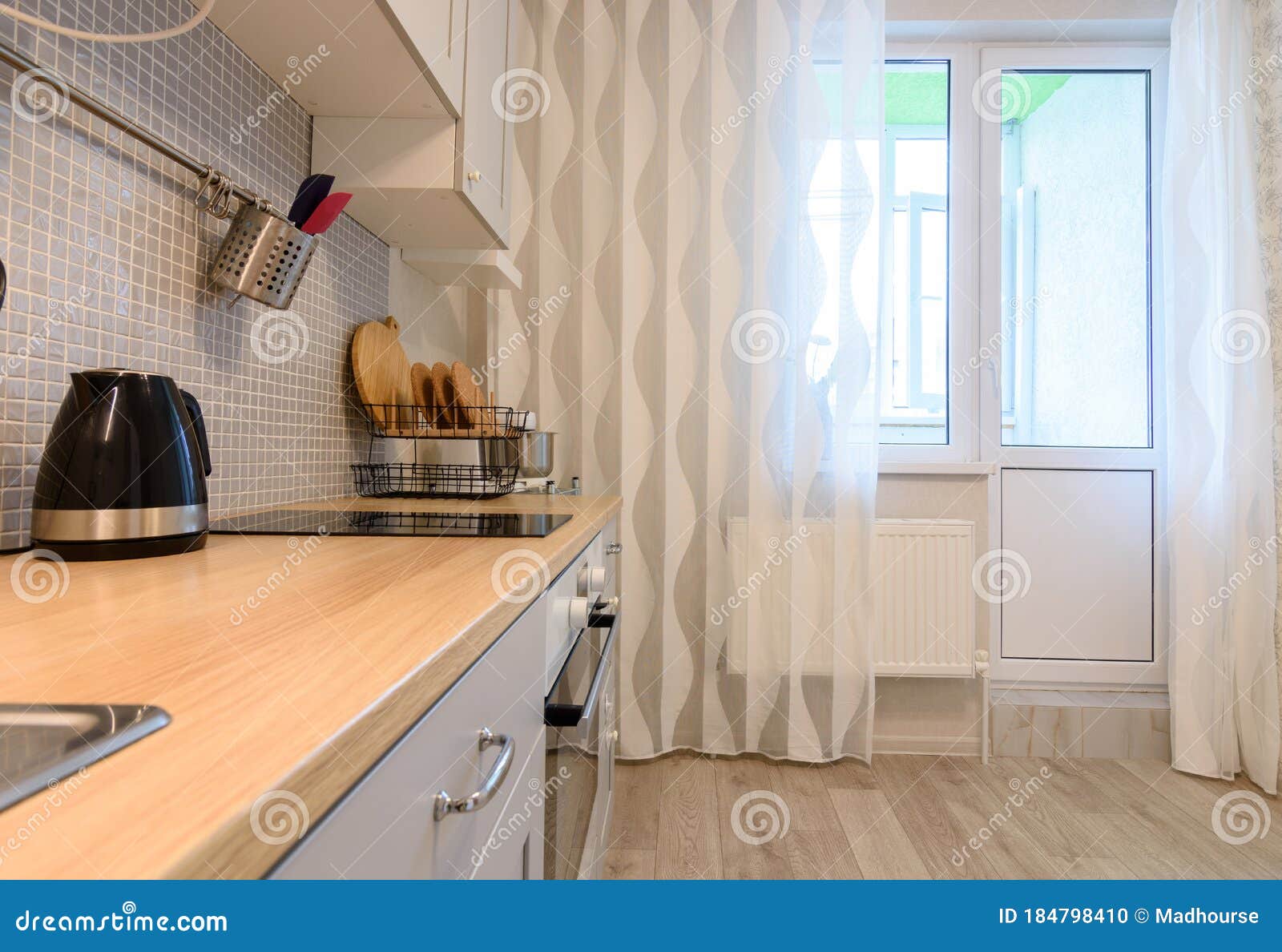 View of the Kitchen and Exit To the Balcony in the Background Stock ...