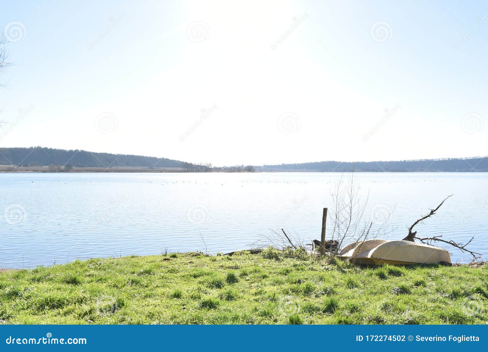 View of the Lake Shore and the Boat Stock Photo - Image of blue ...