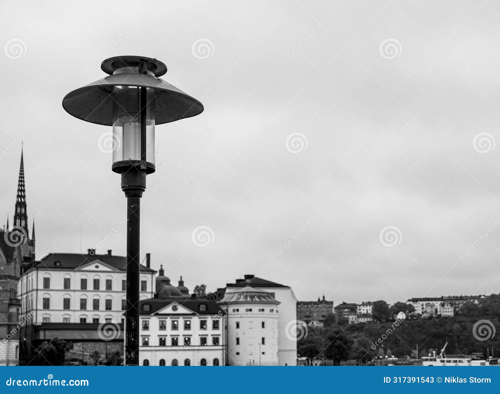 View of a Lamp Post in Front of Buildings Stock Image - Image of spire ...
