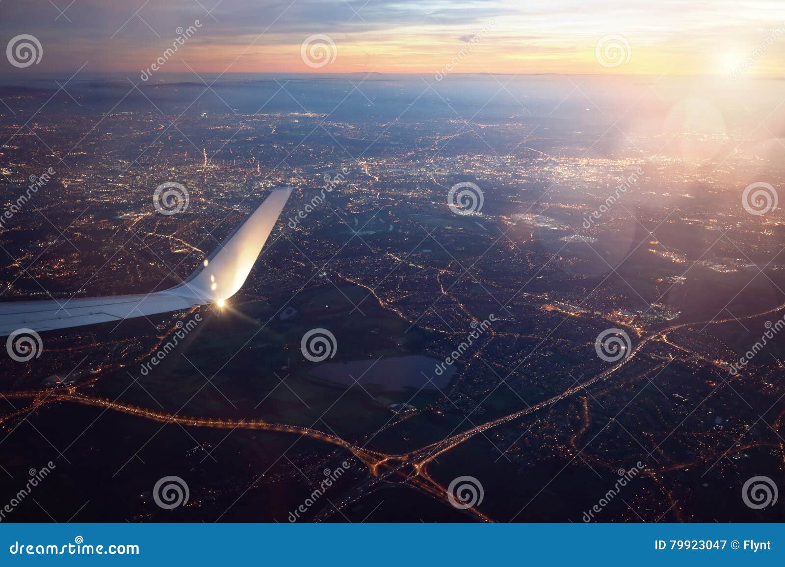 View from Landing Airplane Window of City at Sunset Stock Image - Image ...