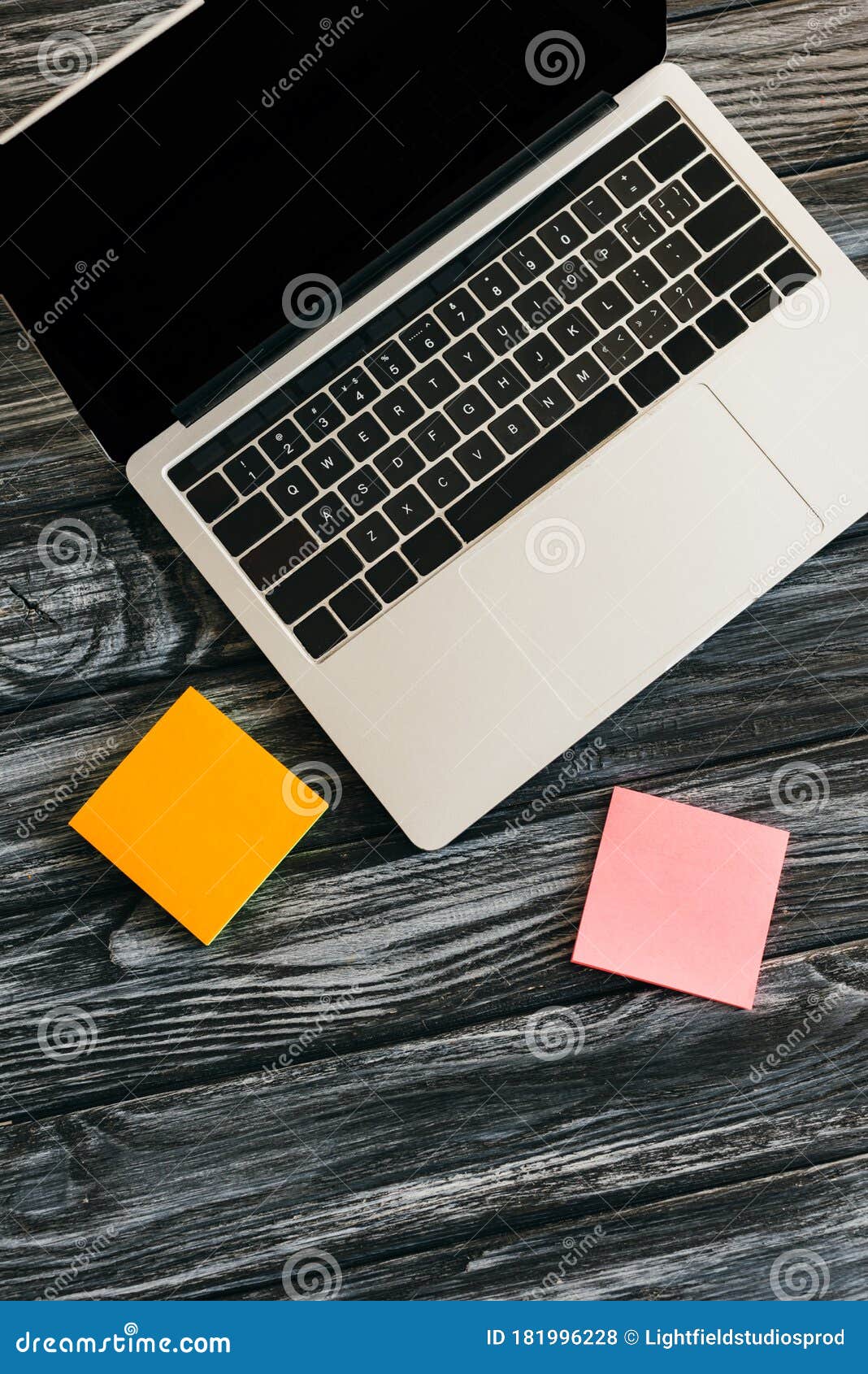 View of Laptop with Blank Screen and Sticky Notes on Dark Wooden ...