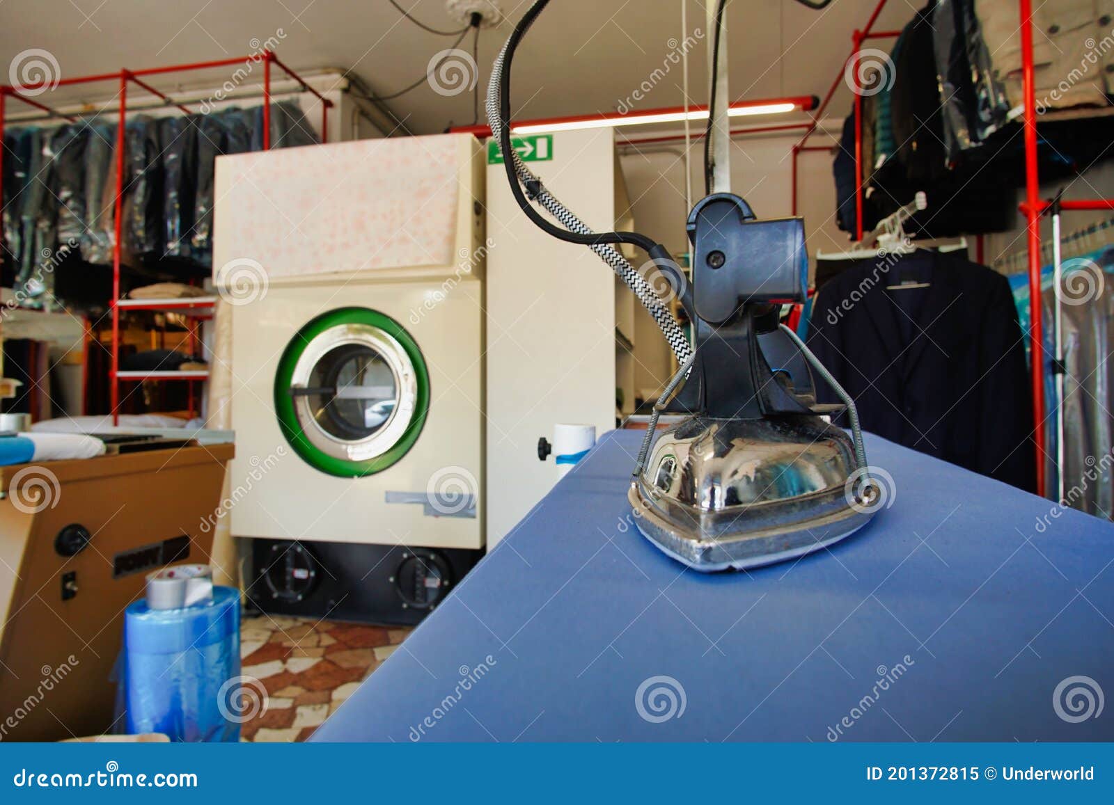 View of Laudry from Inside with Tools, Washing Machine and Iron Stock ...
