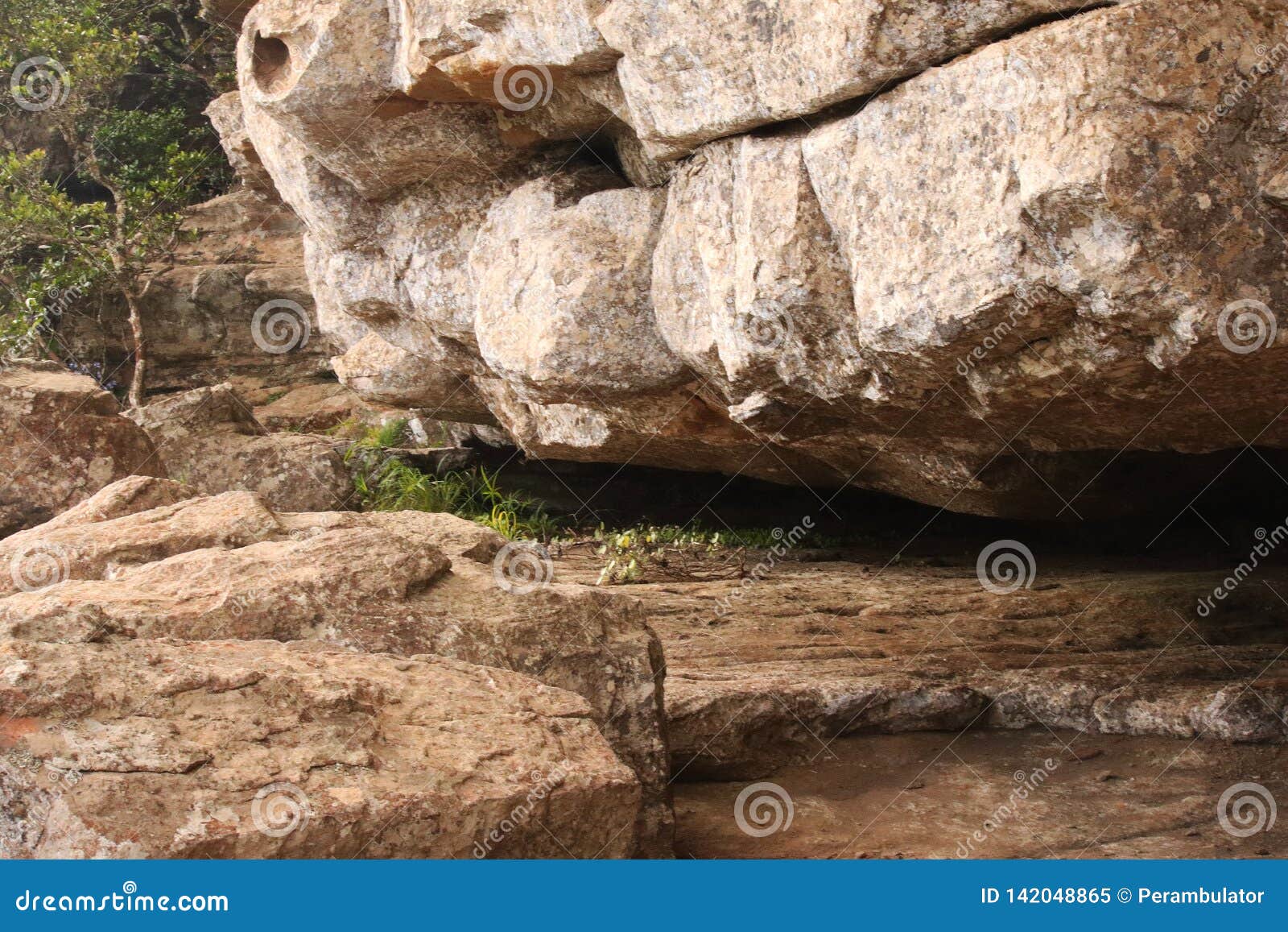 LARGE OVERHANGING ROCK stock image. Image of large, texture - 142048865