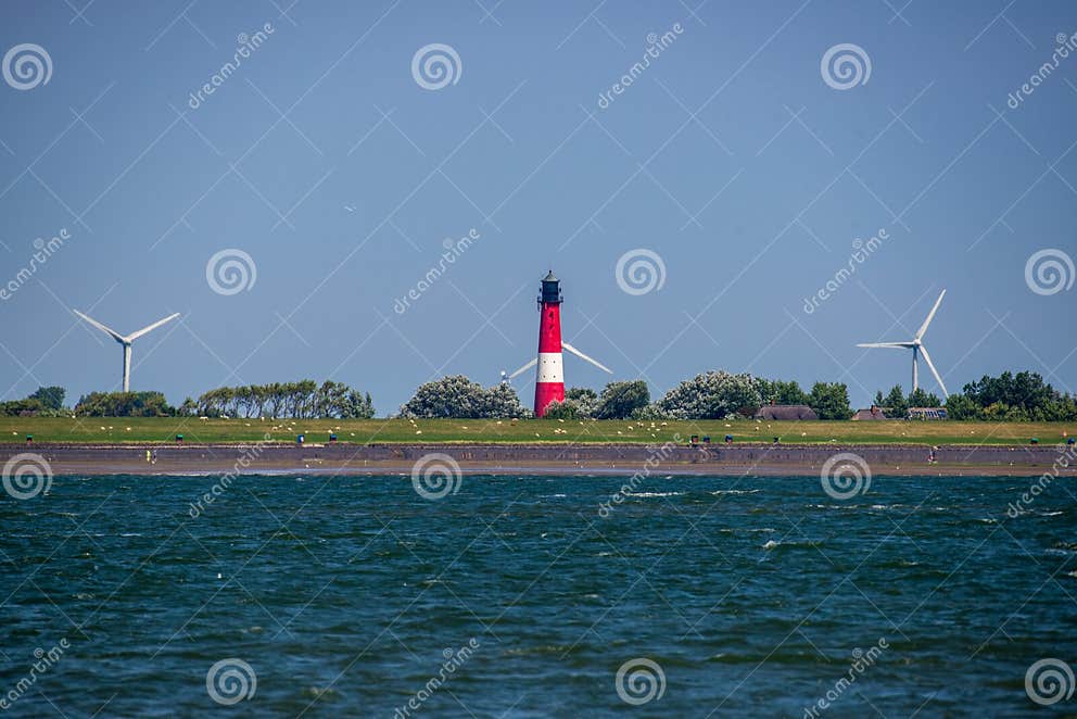 Lighthouse with Wind Turbines Stock Image - Image of beach, built ...