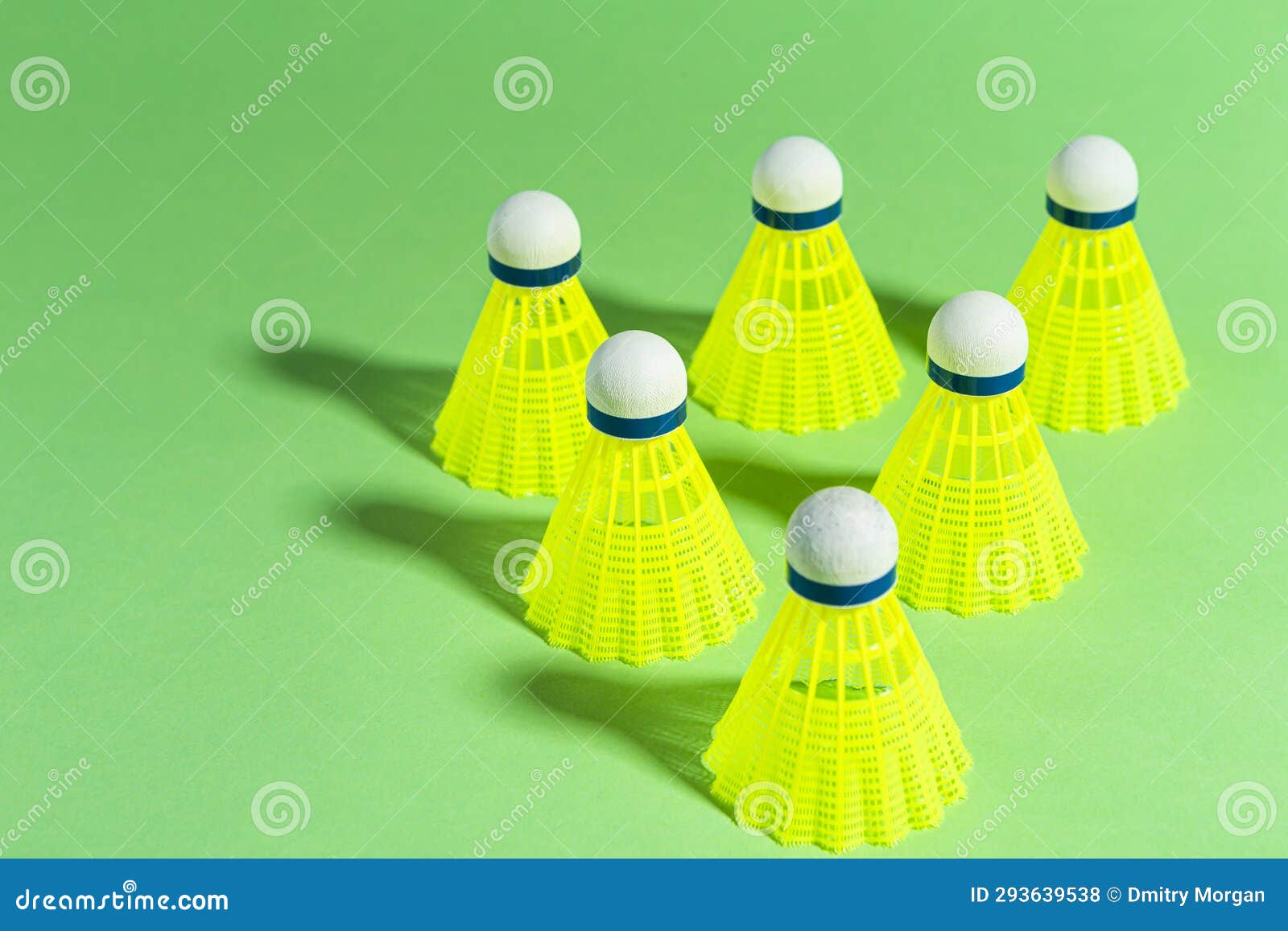 View of Line of New Shuttlecocks on Green Background As Flatlay with ...