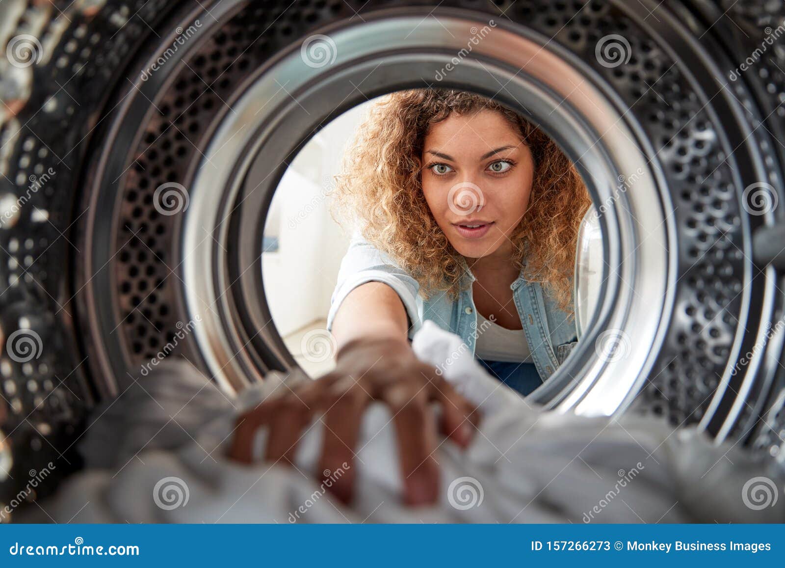 View Looking Out from Inside Washing Machine As Woman Does White ...